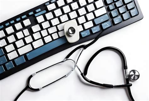 Premium Photo A Pair Of Eyeglasses Next To A Keyboard With A Pair Of Eyeglasses