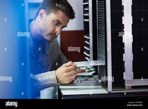 Engineer Inserting Chip Into Machine Stock Photo Alamy