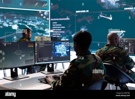 Military Professionals In A Mission Control Center Employs Modern Technology To Analyze
