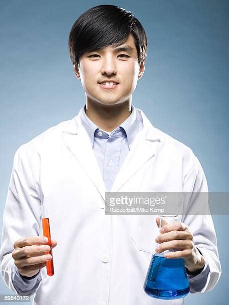 Portrait Of A Male Scientist Holding A Test Tube Photos And Premium