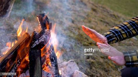 Hands Over Fire Photos And Premium High Res Pictures Getty Images