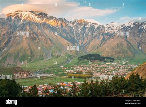 Stepantsminda Village At Sunny Evening Sunset In Kazbegi District
