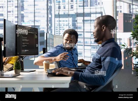 Manager In Wheelchair Checks On Employee Testing Machine Learning Company Software To Minimize