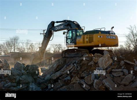 An Excavator Removes Larger Pieces Of Rubble After Demolition Begins On Offutt Air Force Base