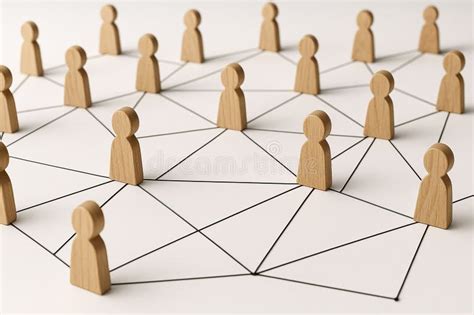 Wooden Human Figures Connected By Lines On White Surface Representing Network Teamwork Social