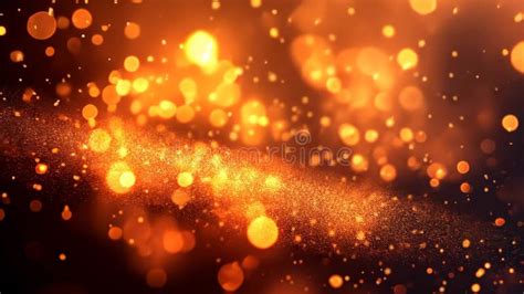 Sparkling Golden Particles Swirl Gracefully Through A Dark Background Creating A Mesmerizing
