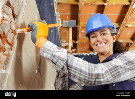 Happy Female Builder With Hammer And Chisel Stock Photo Alamy