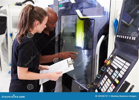 Female Apprentice Working With Engineer On Cnc Machinery Stock Image Image Of Clipboard