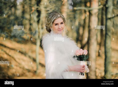 Beautiful Bride Woman Portrait With Bridal Bouquet Posing In Her