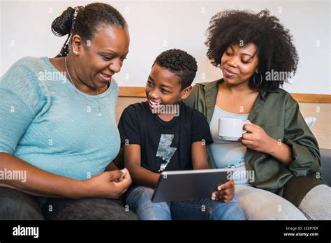 Grandmother Mother And Son Using Digital Tablet Stock Photo Alamy