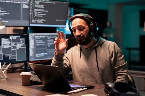 Premium Photo Software Developer Attending Video Call Conference Online On Laptop Using