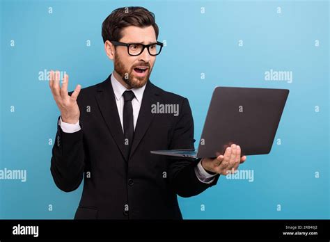 Photo Of Angry Shocked Boss Wear Black Tuxedo Spectacles Reading Failed Report Modern Gadget