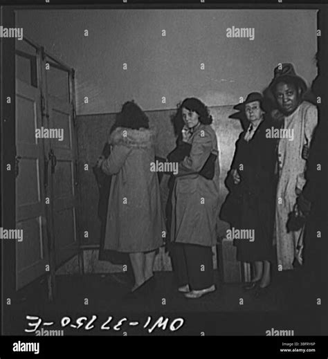 Photograph Of Bus Passengers Primarily Women Waiting In Line To Use The Free Restroom At The