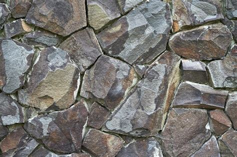 The Wall Is Lined With Natural Stone Texture Premium Photo