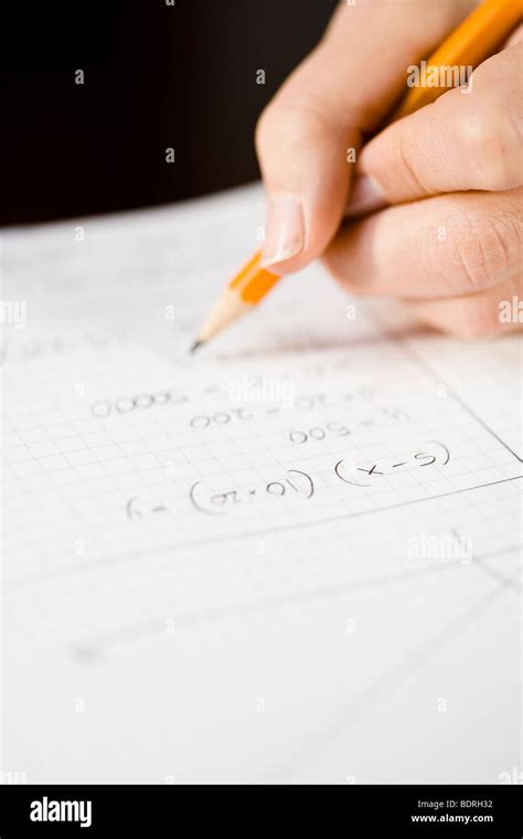 A Woman Working Out A Sum Close Up Stock Photo Alamy