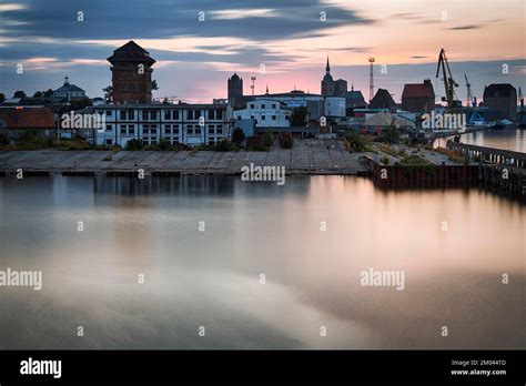 Harbour Buildings Construction Cranes And Church Towers Skyline At