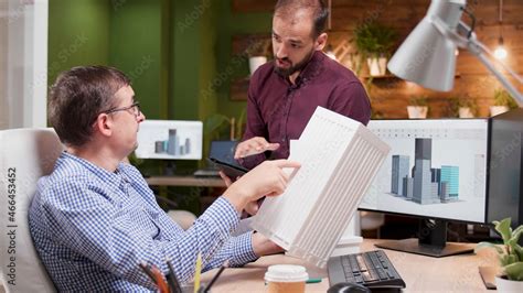 Architects Team Analyzing Building Maquette Discussing Architectural Prototype Structure Working
