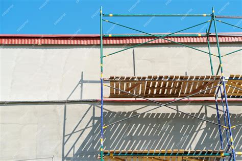 Premium Photo Scaffolding Is Installed Along The Wall Of The Building
