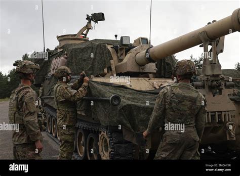 A Us Army Artillery Crew Assigned To Alpha Battery 3rd Battalion