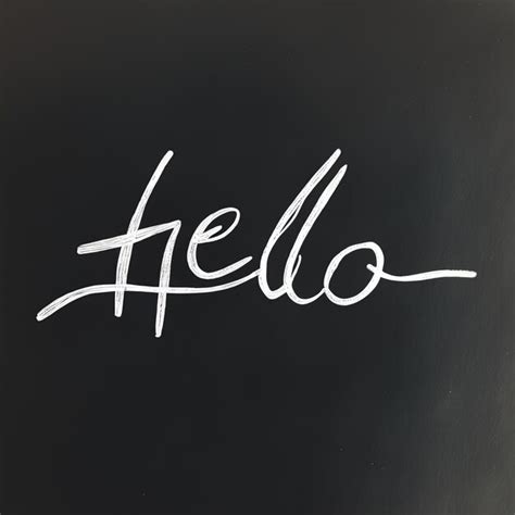 Premium Photo Chalk Handwritten Hello On A Black Deskhandwritten