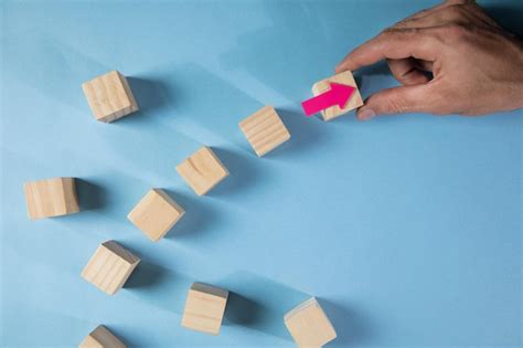 Premium Photo Young Business Man Holding Cubes And Target
