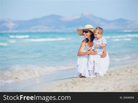 Babe Mother With Her Son On Beach Vacation Free Stock Images Photos