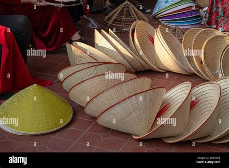 Traditional Vietnamese Conical Leaf Hats For Sale In Market Warm