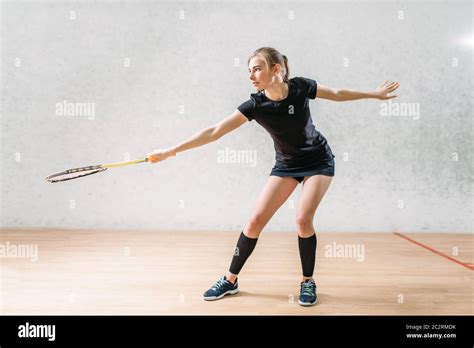 Squash Game Training Female Player With Racket In Hands Indoor Sport Club On Background Stock