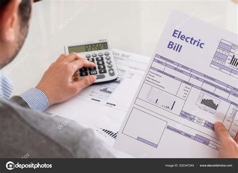 Calculating Energy Efficiency And Energy Bill Papers Stock Photo