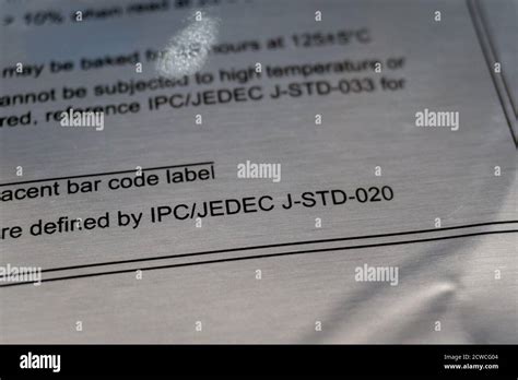 Close Up Of Bag Caution Warning Label IPC JEDEC J STD 020 Standard Reference From Electronics