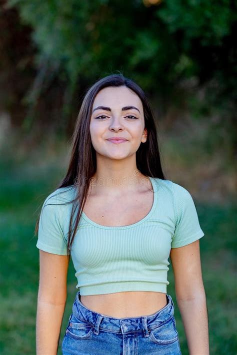 Brunette Young Beautiful Teenager Girl Outside Enjoying A Beautiful Day