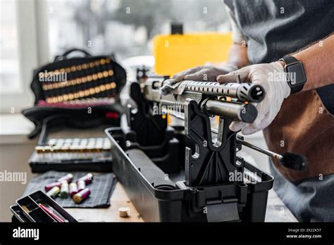The Gunsmith Maintaining His Rifle In A Workshop Stock Photo Alamy