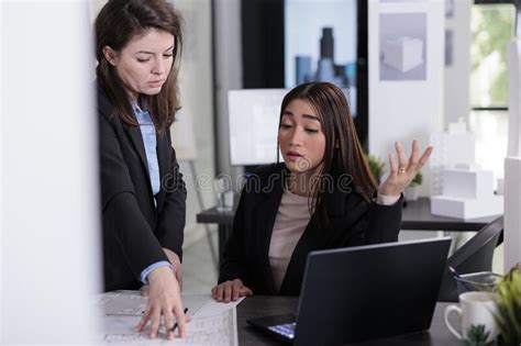 Architects Working With Blueprints Discussing Architectural 3d Model Stock Image Image Of