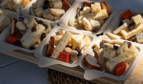 Premium Photo Appetizer Of Assorted Cheeses And Nuts In Individual