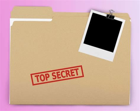 Premium Photo A Manila Folder With The Faded Words Top Secret On The
