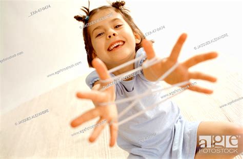 Babe Girl With String Game On Hands Stock Photo Picture And Rights Managed Image Pic EXA 47