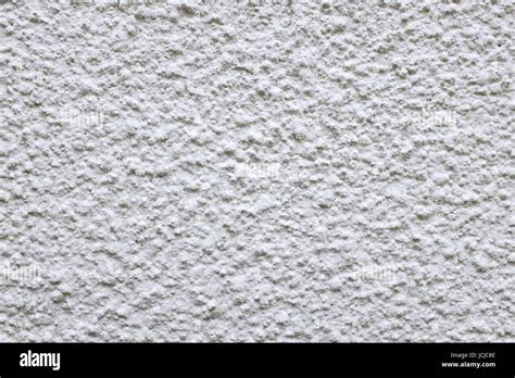 Wall Of Rough Cement Render Painted White As An Abstract Background