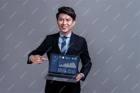 Premium Photo Businessman Posing With Laptop Showing Bi Data Analysis Dashboard Jubilant