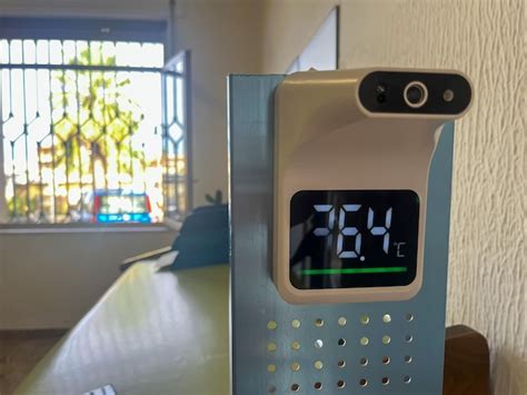 Premium Photo Noncontact Modern Device For Monitoring Body Temperature Using An Infrared