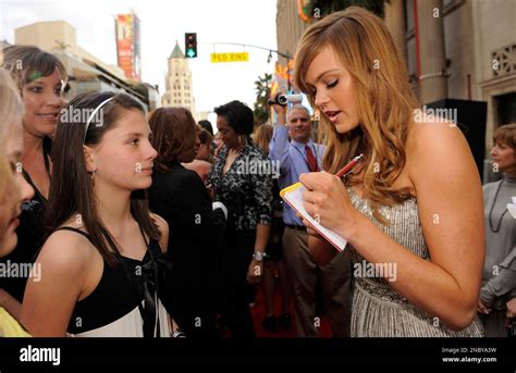 Aimee Teegarden Right A Cast Member In Prom Signs An Autograph For