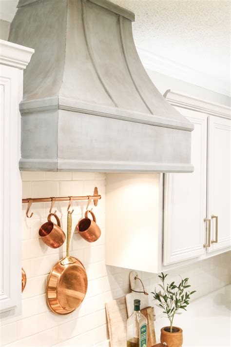 White Kitchen With Copper Accents To Create A Vintage Aesthetic