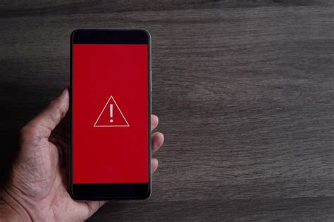 premium photo smartphone with triangle caution warning icon copy