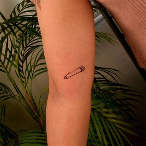 Minimalistic Safety Pin Tattoo Located On The Inner