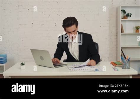 Medium Video Of A Young Man Sitting In The Office Working On A Laptop
