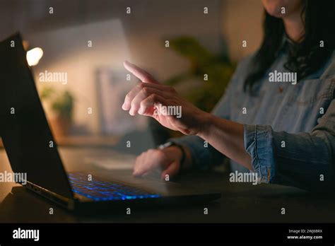 Computer Security Concept With Overlay Projected Onto Screen Of Woman Using Laptop Stock Photo