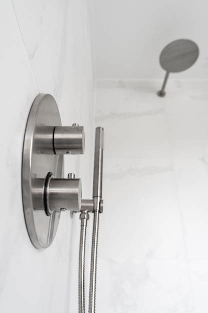 Premium Photo Low Angle View Of Knobs On Wall In Bathroom