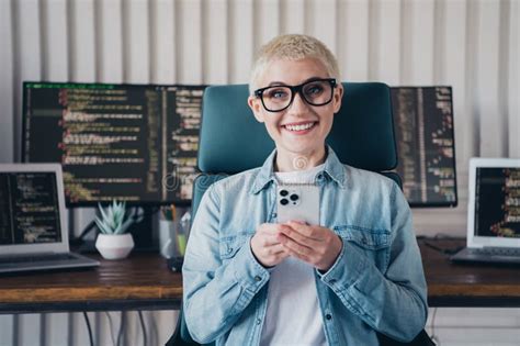 Smiling Female Programmer Using Smartphone Modern Workspace Stock