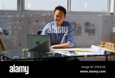Animation Of Mathematical Equation And Diagrams Asian Architect Designing Blueprint On Laptop