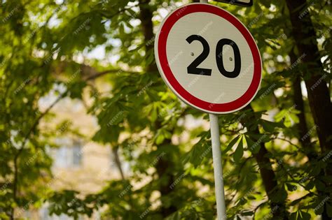 Premium Photo The Road Sign For The Speed Limit Is 20 Kilometers