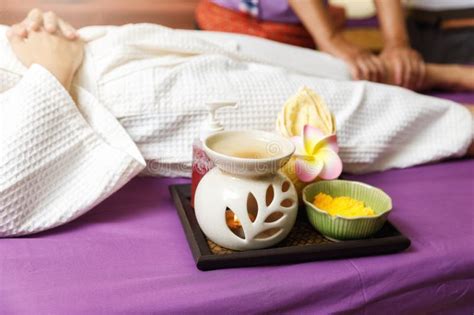 Skin Care Products Set With Woman Receiving Leg Massage Service From
